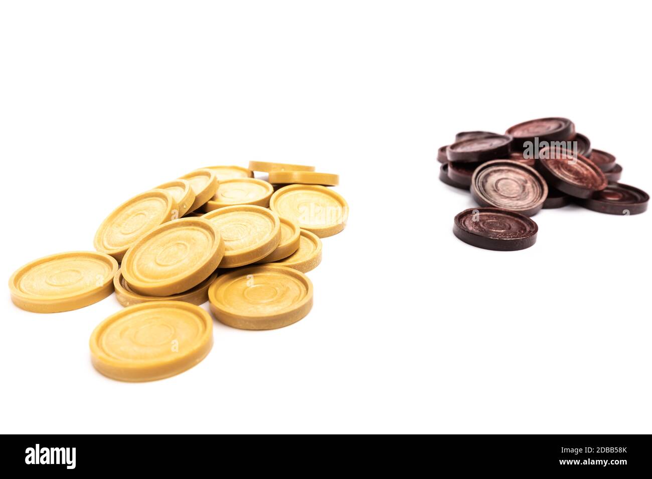 low-end plastic round checkers piece in white background in studio ...