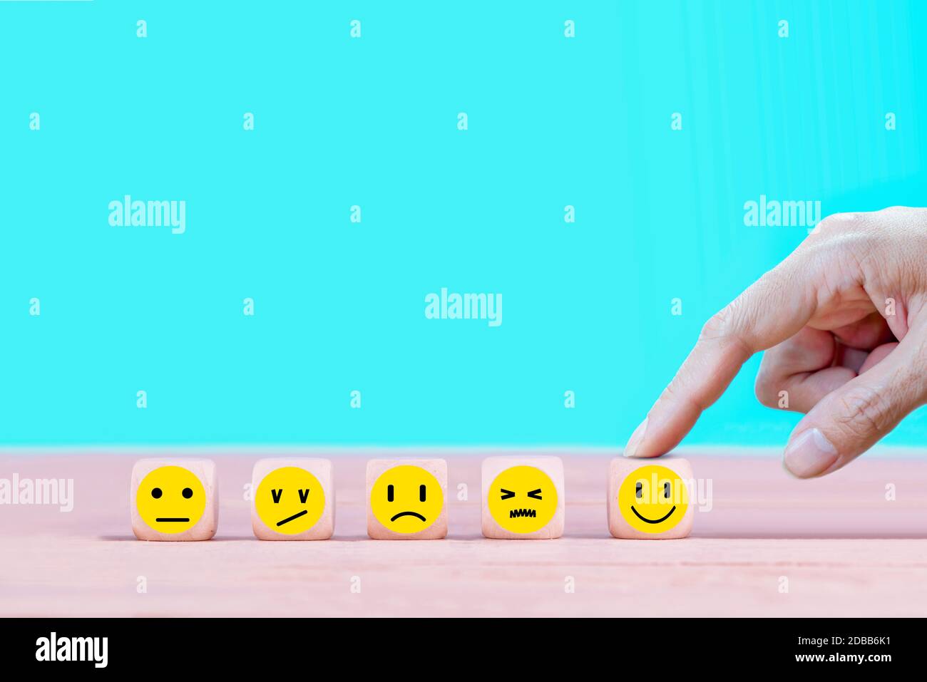 Businessman chooses a happy emoticon icons face. Service, communication ...