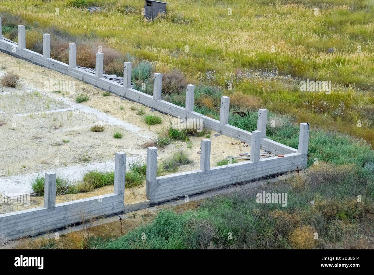 Concrete foundation of the future fence. Concrete fence, fence ...