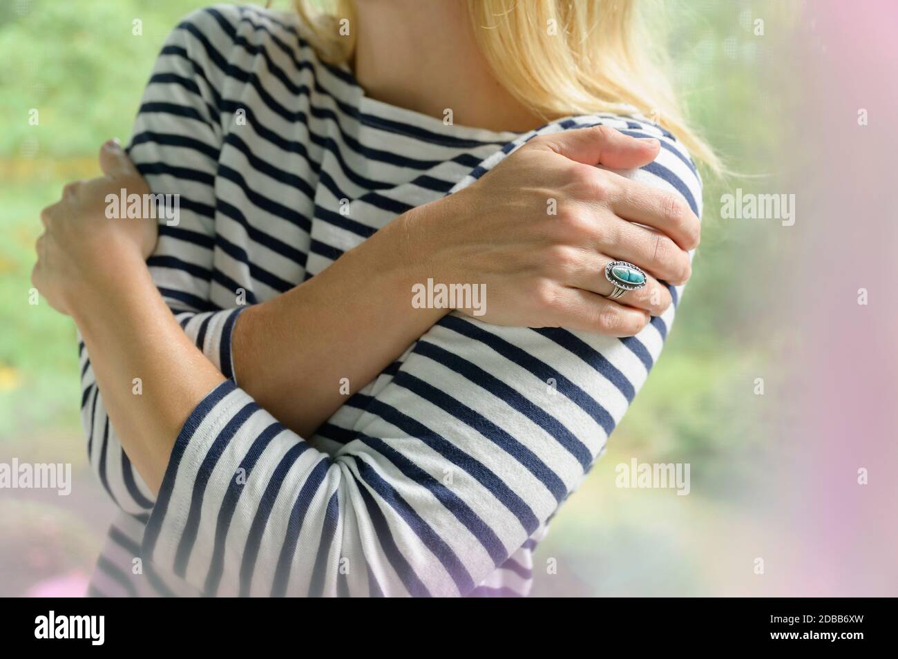 Woman hugging herself hi-res stock photography and images - Alamy