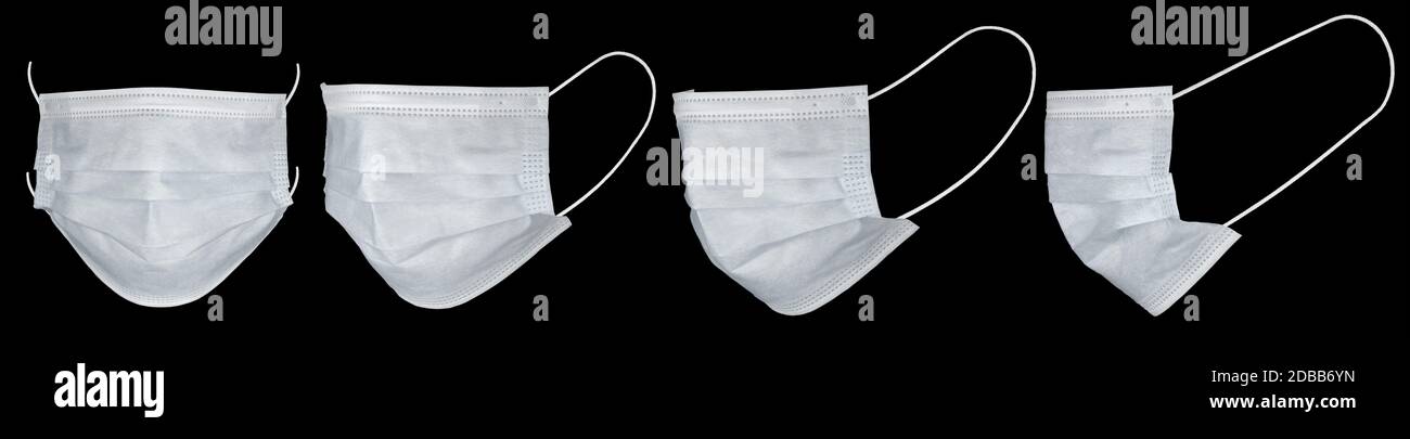 Medical mask or surgical earloop mask isolated on black background with ...