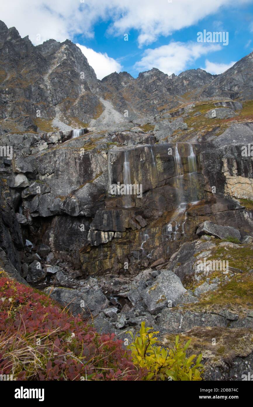 Water falling along mountain trail Stock Photo - Alamy