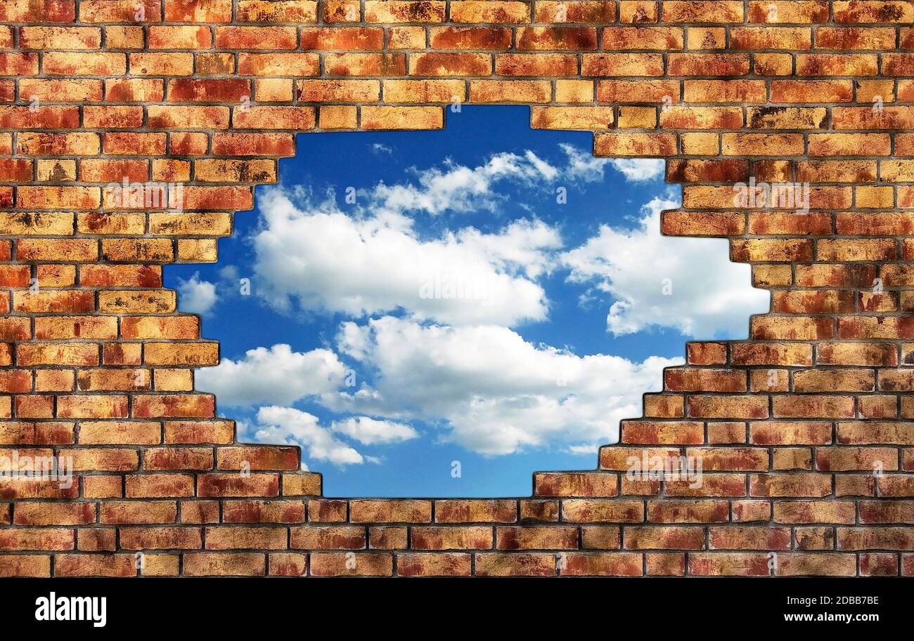 Brick wall with break trough to see the blue sky with clouds Stock ...