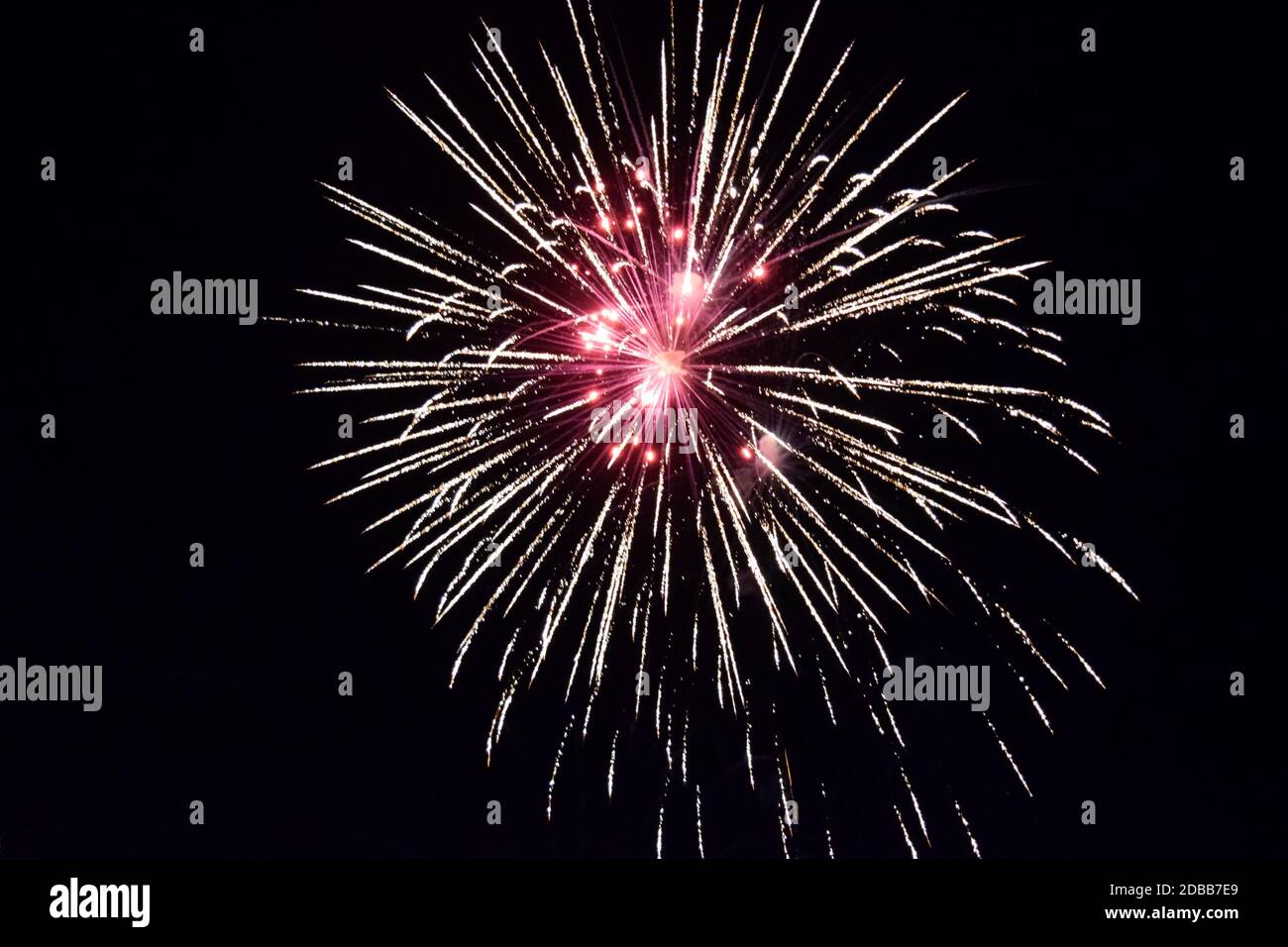 Festive salute in the night sky. Explosions of fireworks and ...