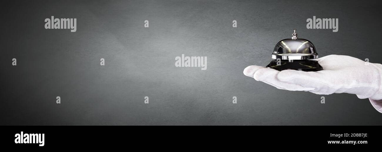 White Glove Offering Service Concierge Bell To Customer Stock Photo - Alamy