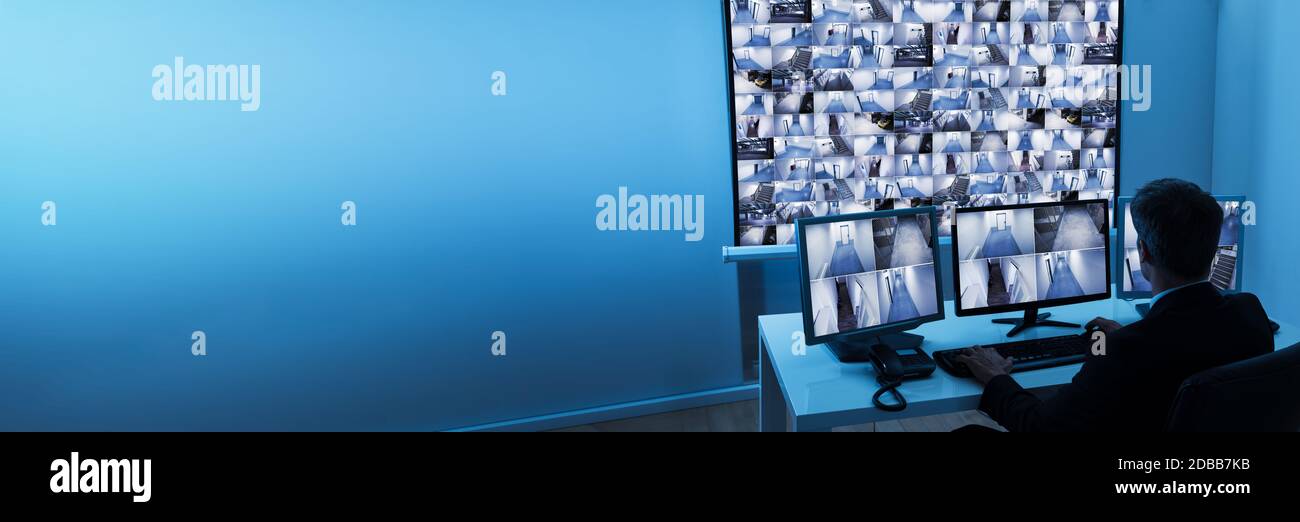 Man Monitoring CCTV Camera In Control Room Stock Photo - Alamy
