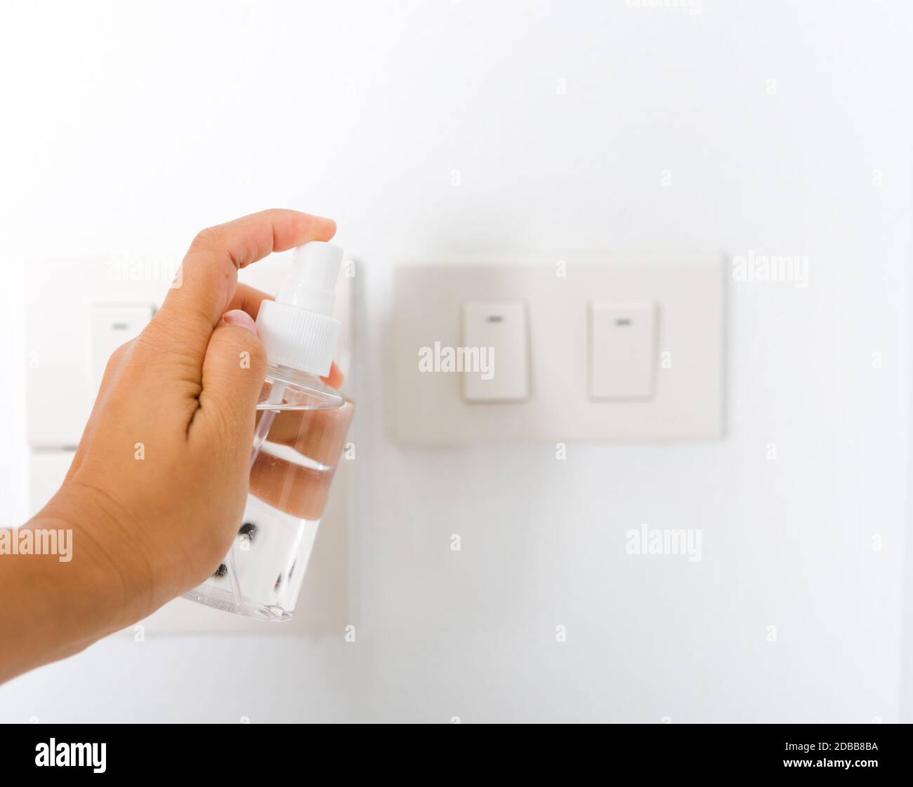 Asian young woman applying press dispenser sanitizer alcohol spray ...