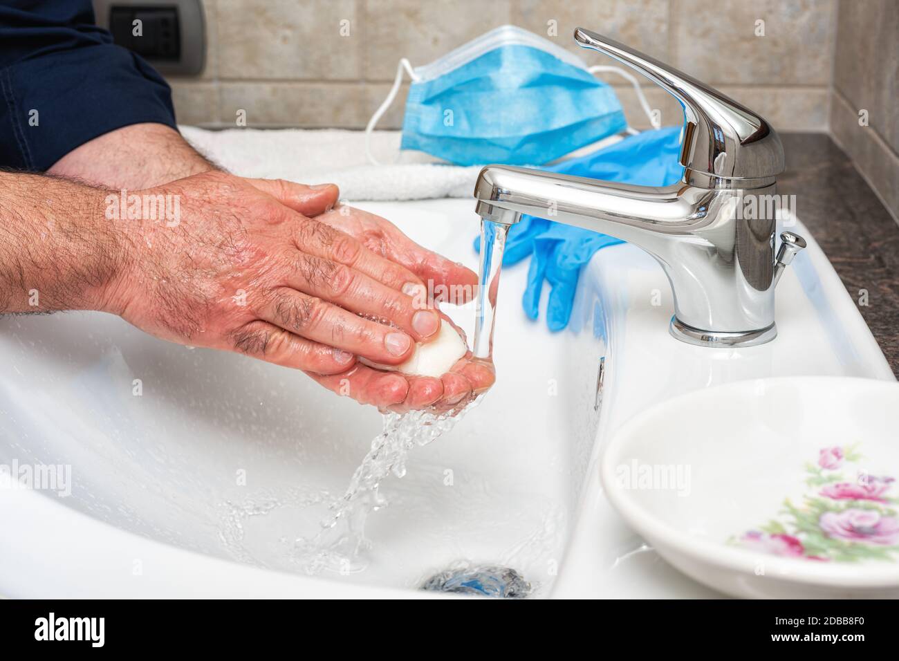 Coronavirus prevention. Hand washing with hot soapy water, the use of ...