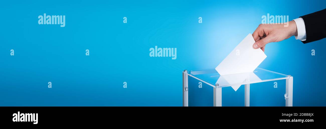 Putting Election Vote In Transparent Glass Box. Ballot Paper Stock ...