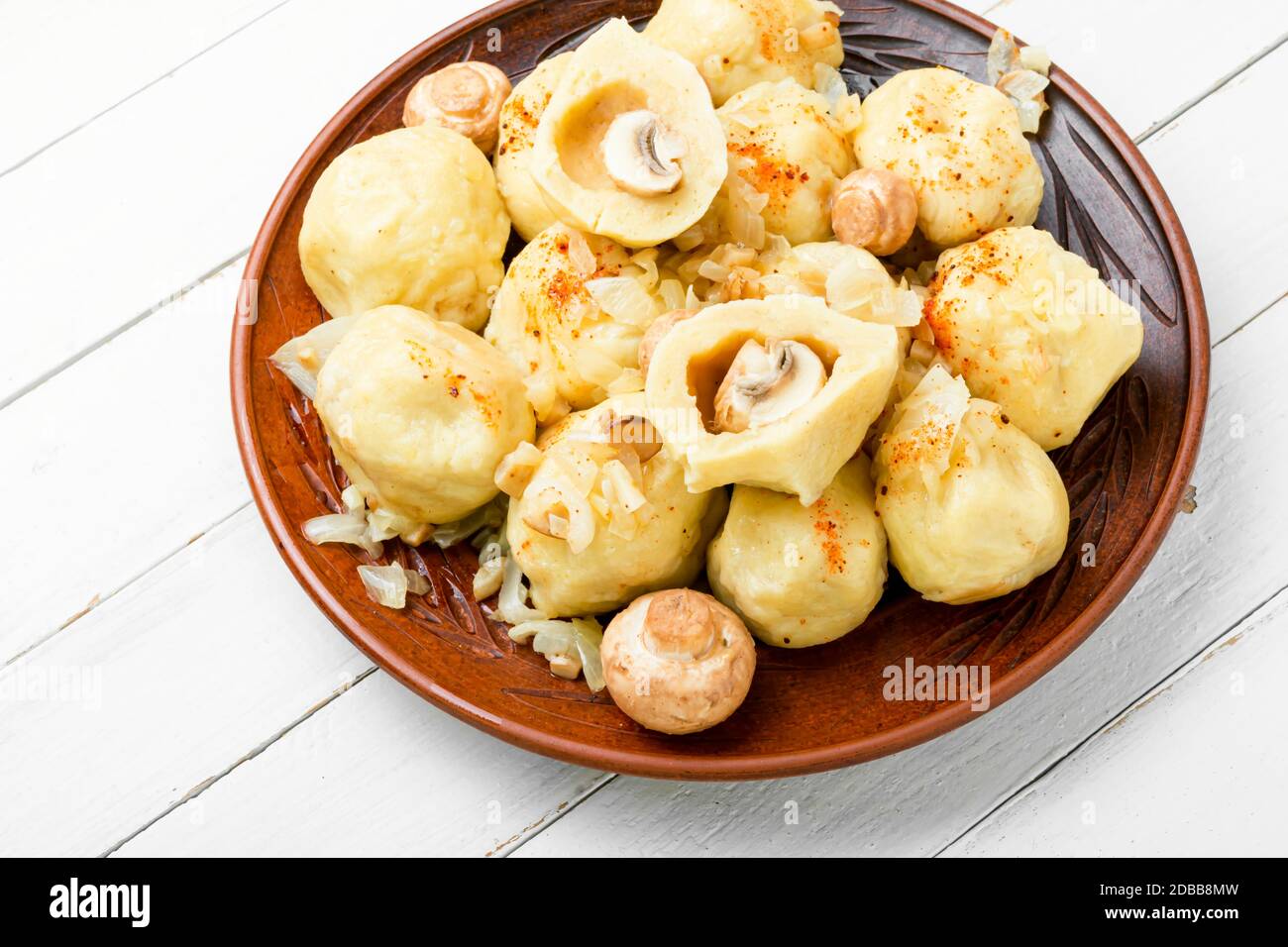 Appetizing homemade dumplings with mushroom filling on white background ...