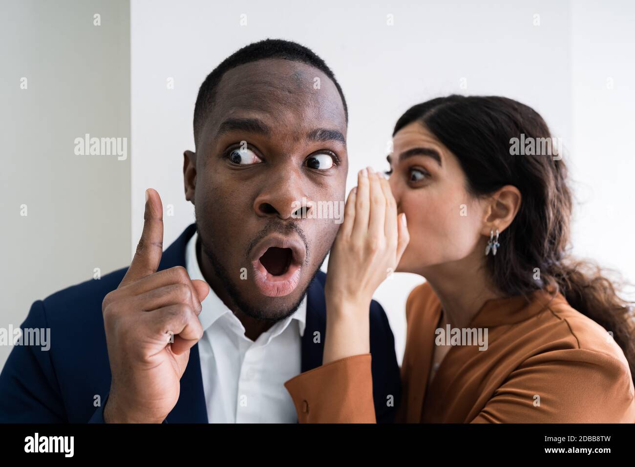 Woman whisper shock man hi-res stock photography and images - Alamy