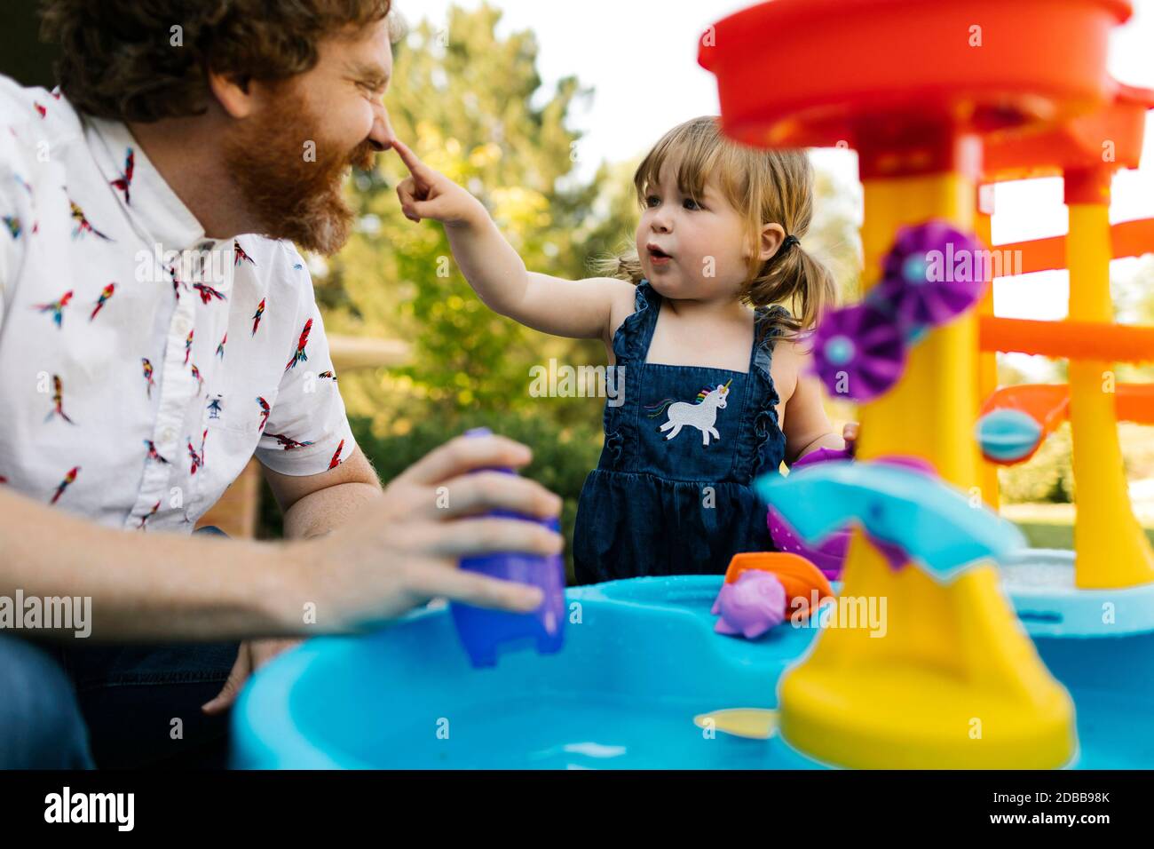 Child touching water hi-res stock photography and images - Alamy