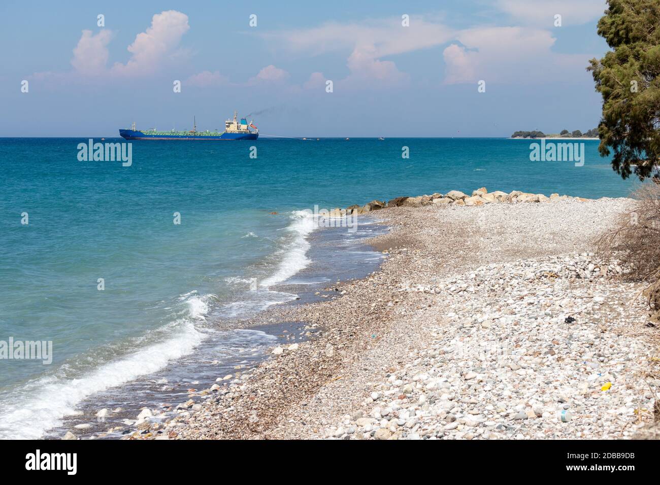 Gravel, pebble beach of Soroni Beach at Rhodes island with ocean waves ...