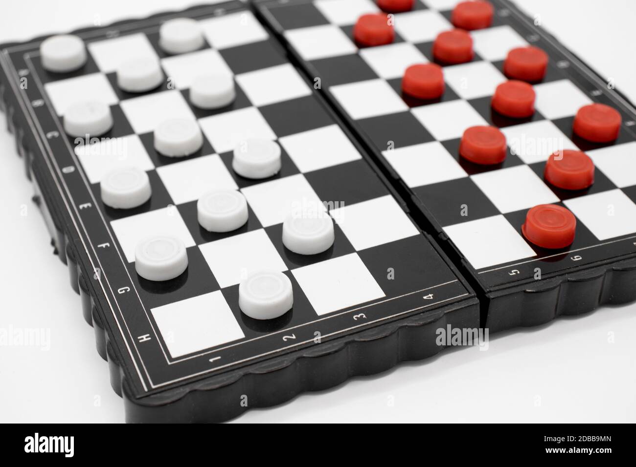 Pocket plastic chess game, checkers on magnets isolated on white ...