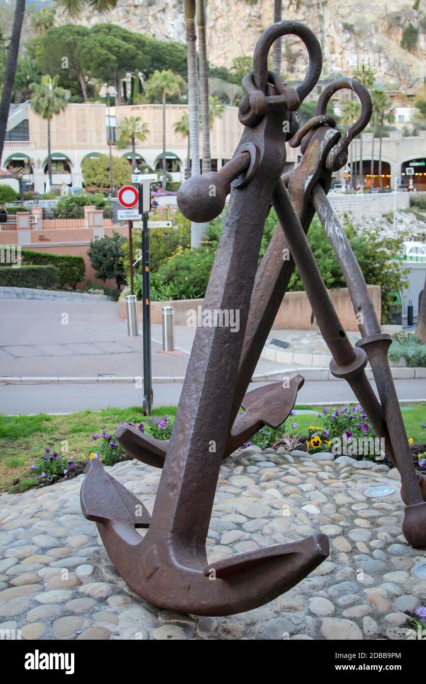 Two large anchors set up on a green island Stock Photo - Alamy