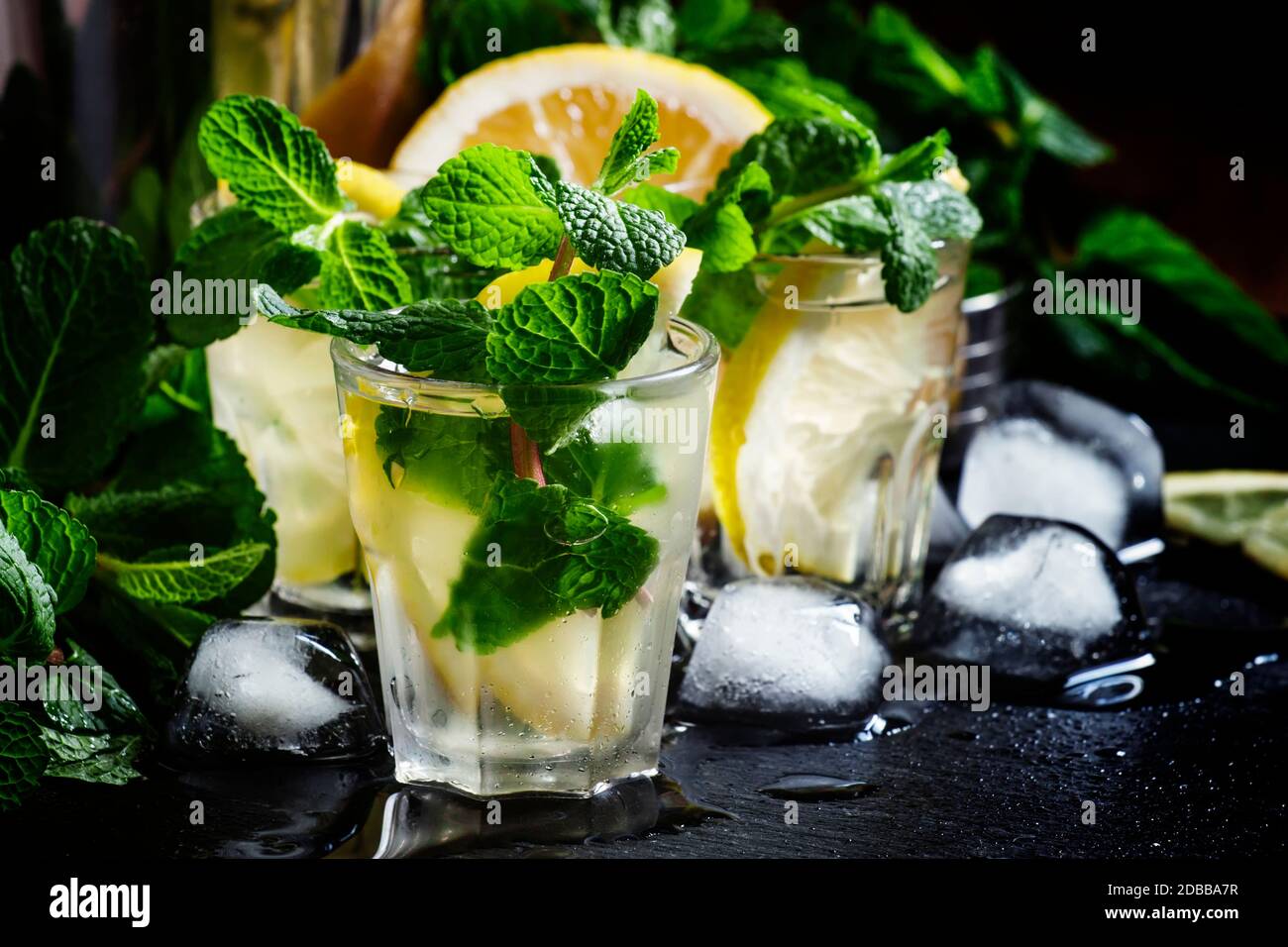 Alcoholic cocktail with vodka and ice mint tea, black background ...