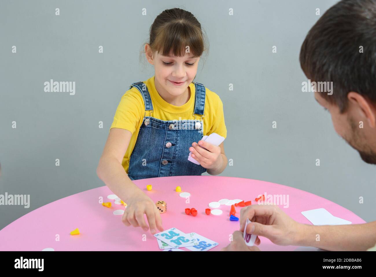 Girl playing board games hi-res stock photography and images - Alamy