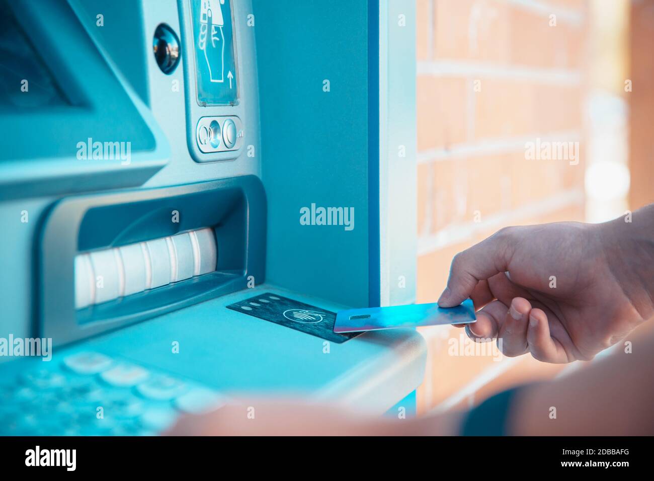 Wireless withdrawal from an ATM with a debit card Stock Photo - Alamy