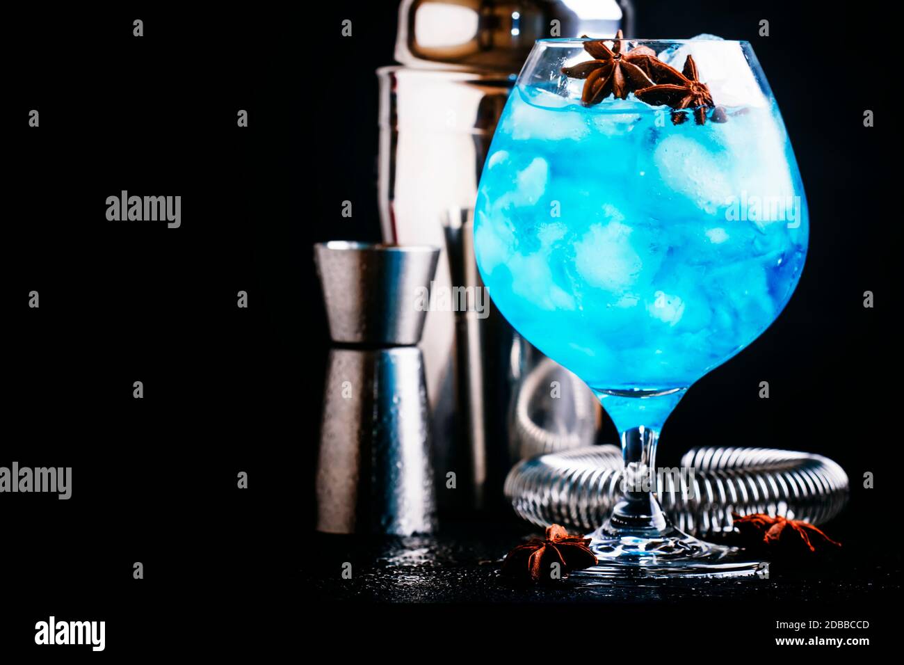 Alcoholic cocktail with sambuca, liqueur, lemon juice, crushed ice and ...