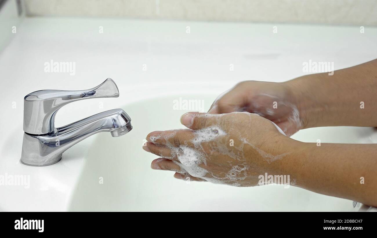 7 steps hand washing - Step 4/7 Interlace fingers and rub the back of ...