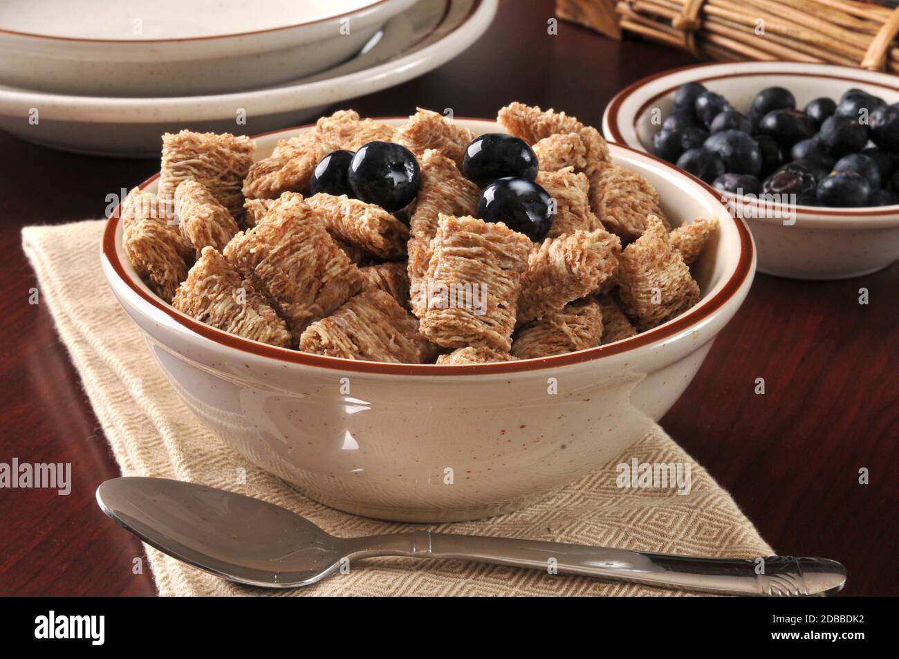 Wheat breakfast cereal biscuits with blueberries Stock Photo - Alamy