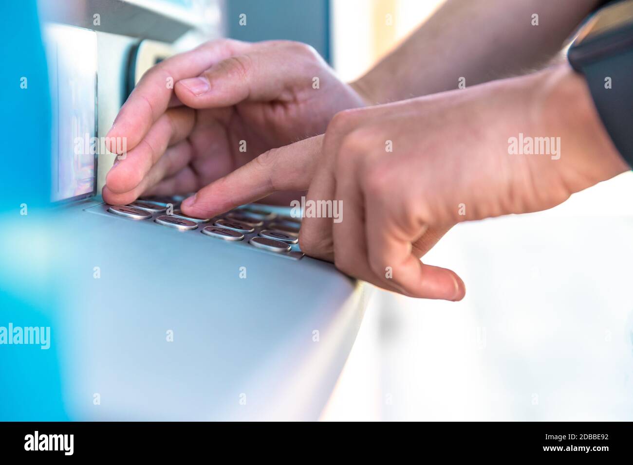 Entering a credit card code on the ATM keyboard Stock Photo - Alamy
