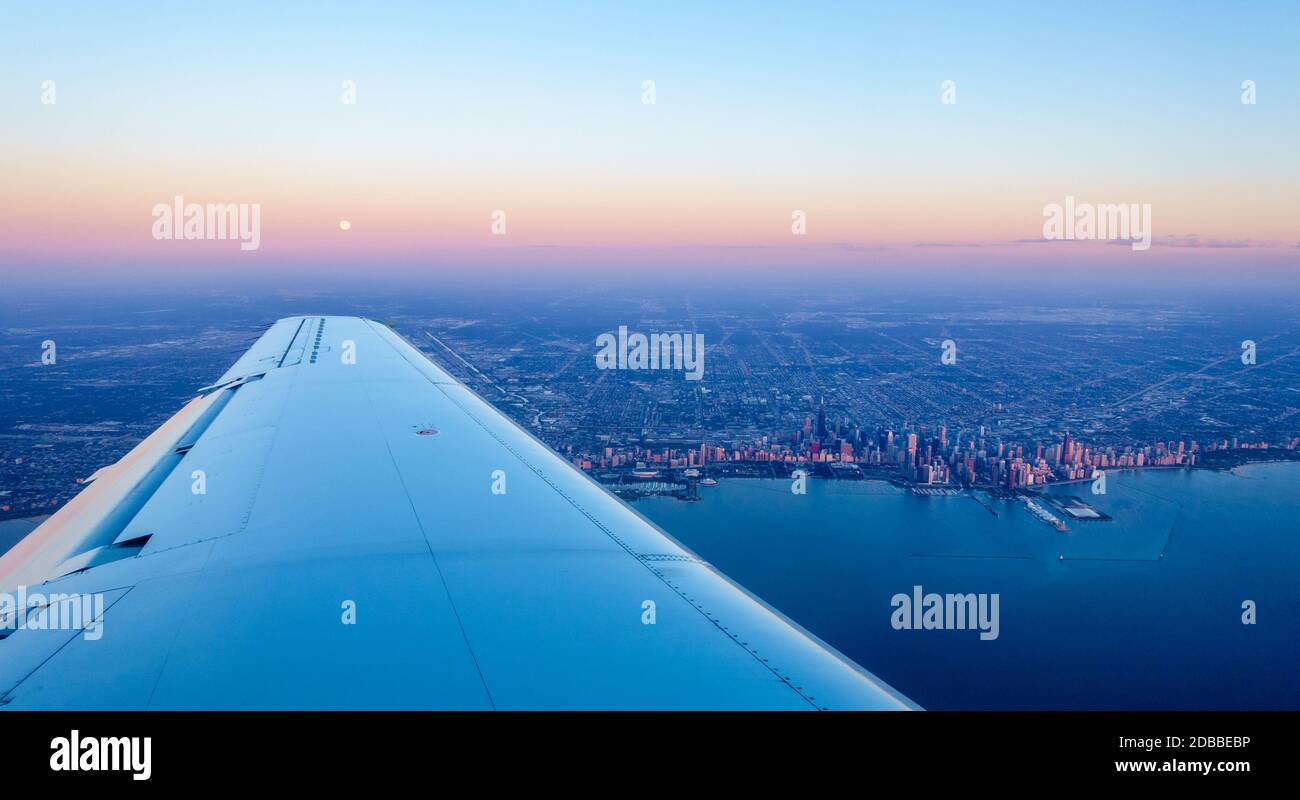 Scenic aerial view from a plane of full moon setting over Chicago Stock ...
