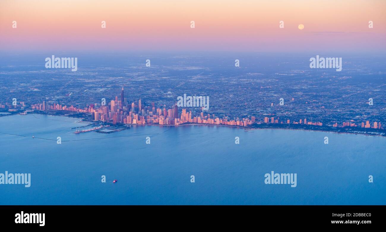 Scenic aerial view of full moon setting over Chicago downtown at ...