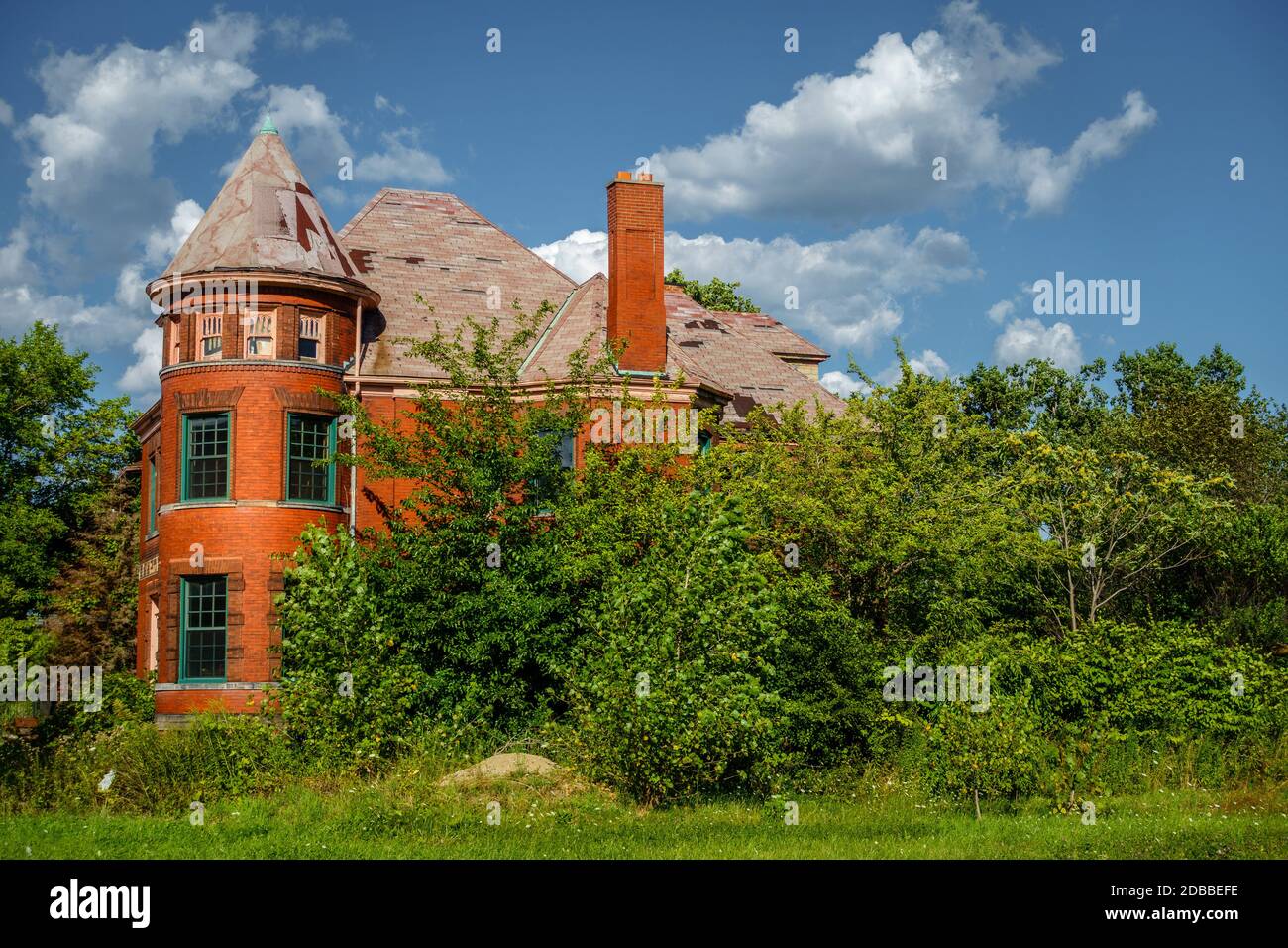 An abandoned house in the city of Detroit is taken over by plants and ...