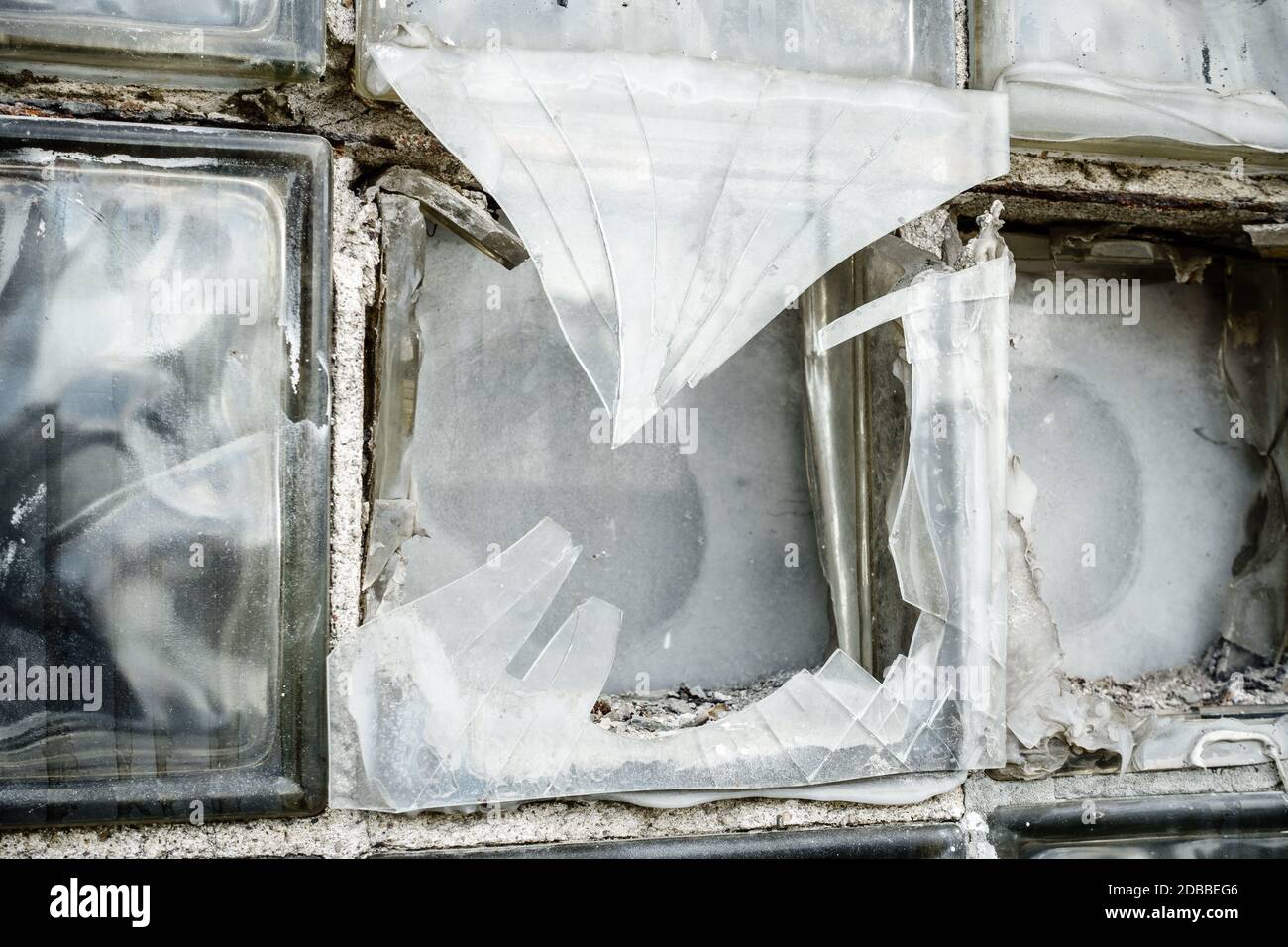 Close-up image of a broken glass box window in an abandoned building ...