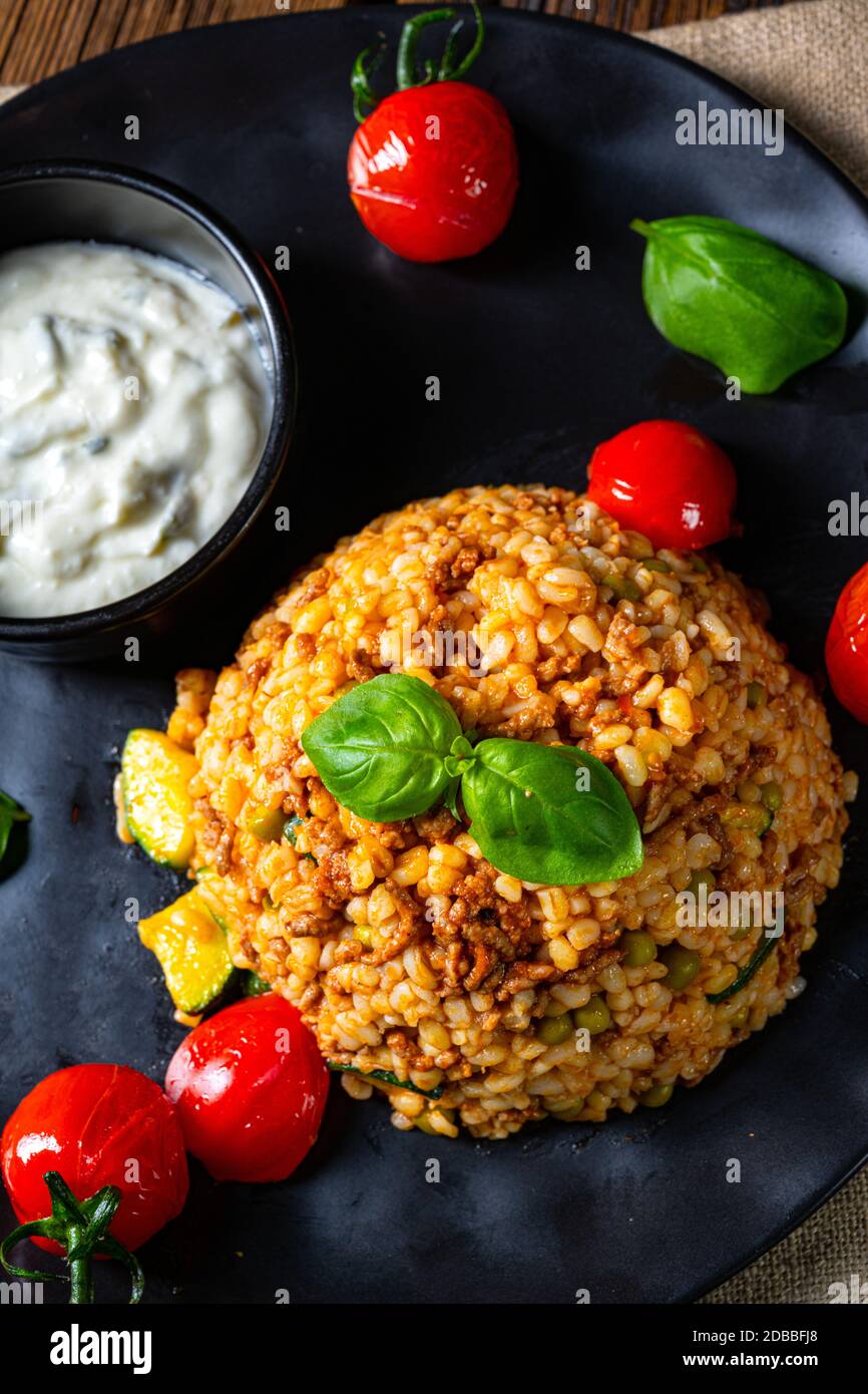 rustic bulgur fried with minced meat and vegetables Stock Photo - Alamy