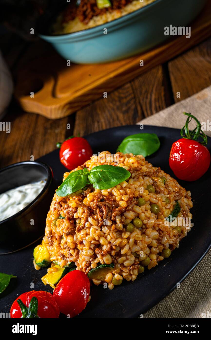 rustic bulgur fried with minced meat and vegetables Stock Photo - Alamy