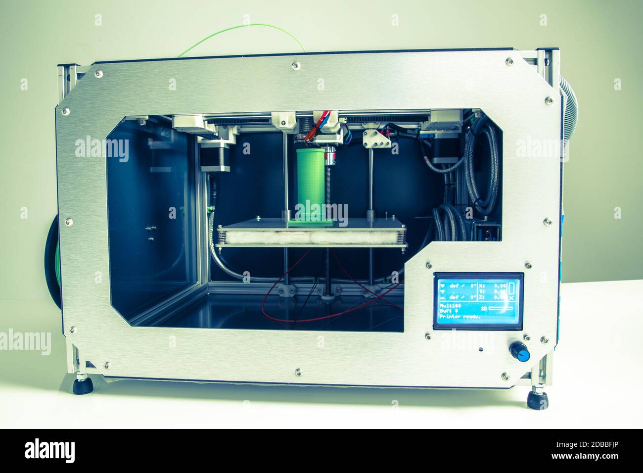 3d printer with bright green filament Stock Photo - Alamy