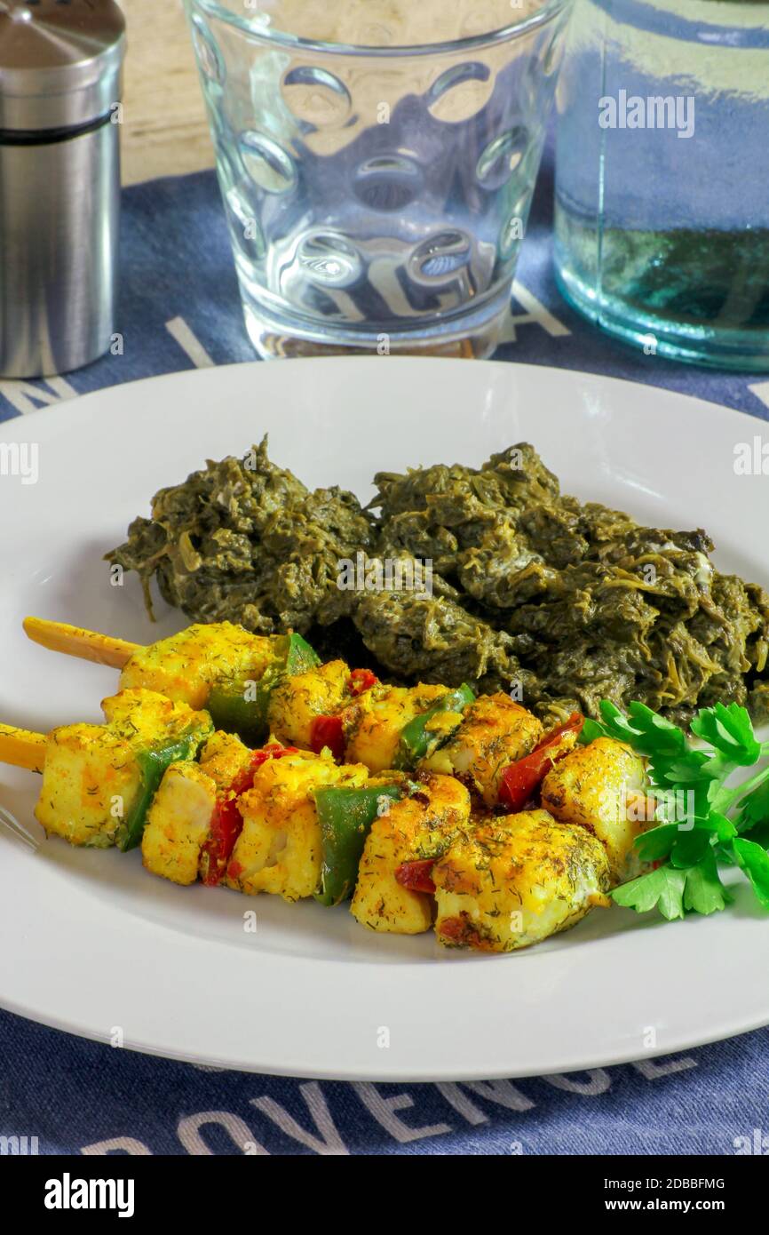 cooked fish and spinach skewers Stock Photo - Alamy