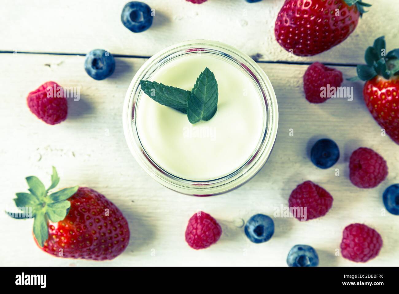 Red fruit compote with mint leaves and fruit Stock Photo - Alamy