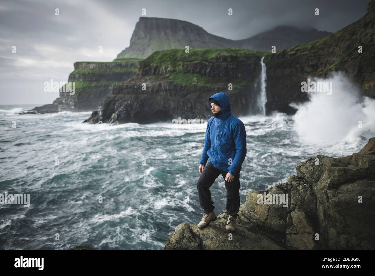 Denmark, Faroe Islands, Gasadalur village, Mulafossur Waterfall, Man ...