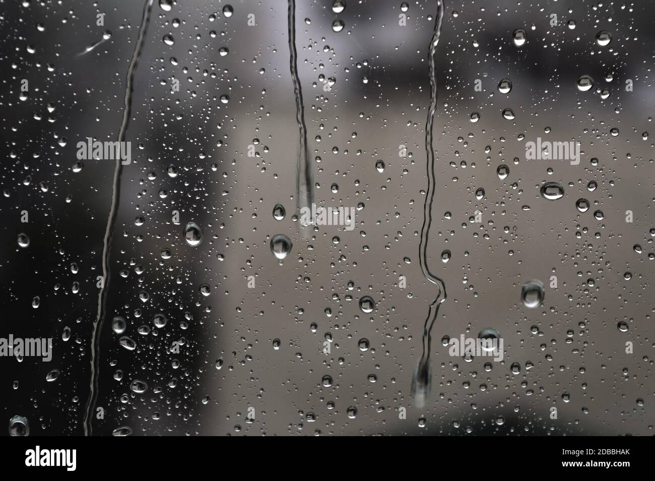 Drops of rain on the window, rainy day, dark tone. Shallow DOF Stock ...