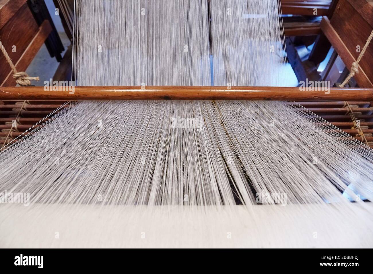 Loom with a texture of fine thread Stock Photo - Alamy