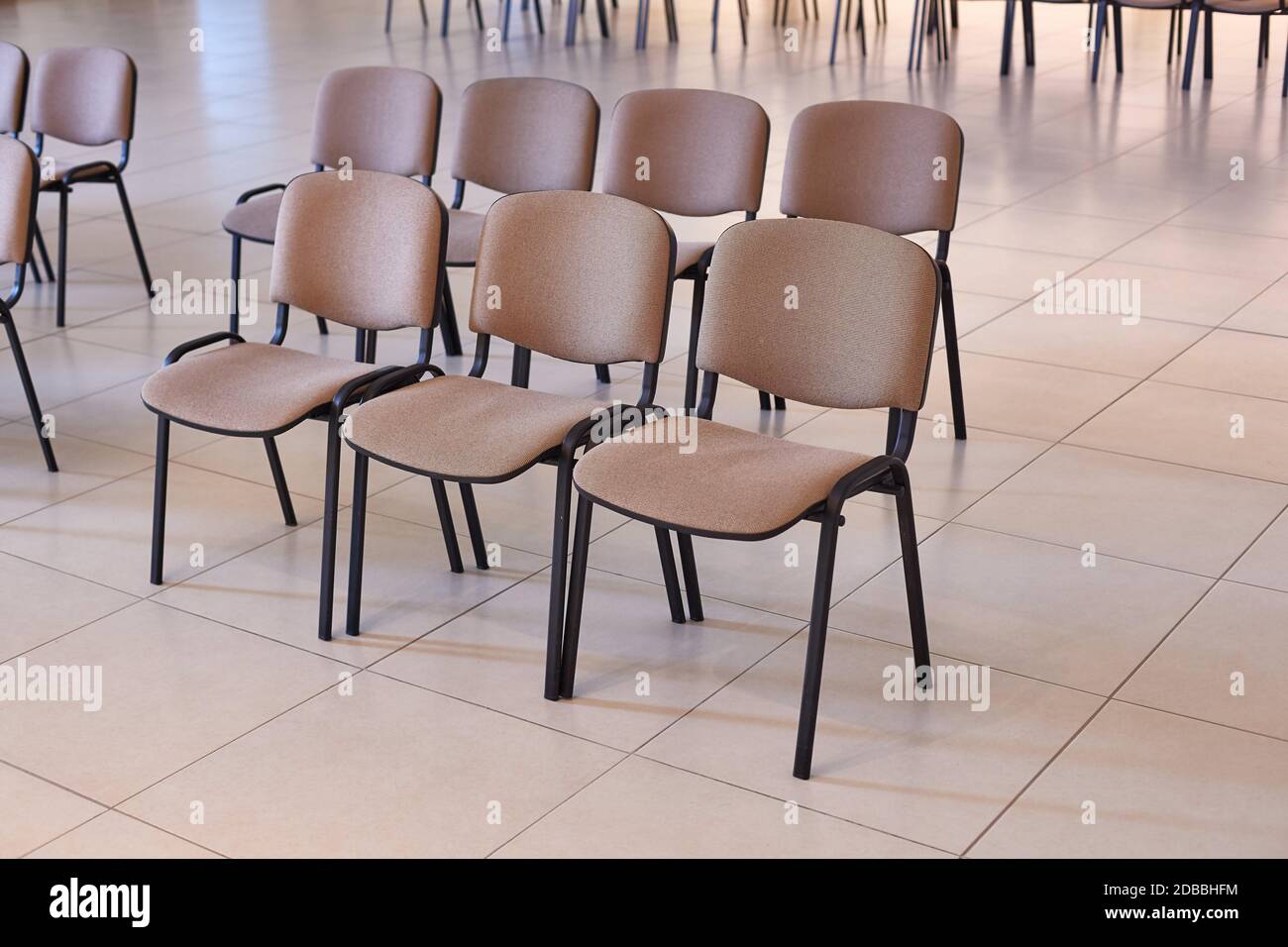Chairs in rows in an empty autditorium, nobody around Stock Photo - Alamy