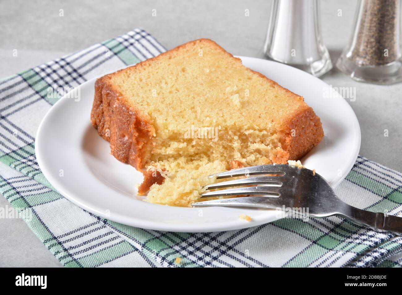 Slice of delicious pound cake with a missing bite Stock Photo - Alamy