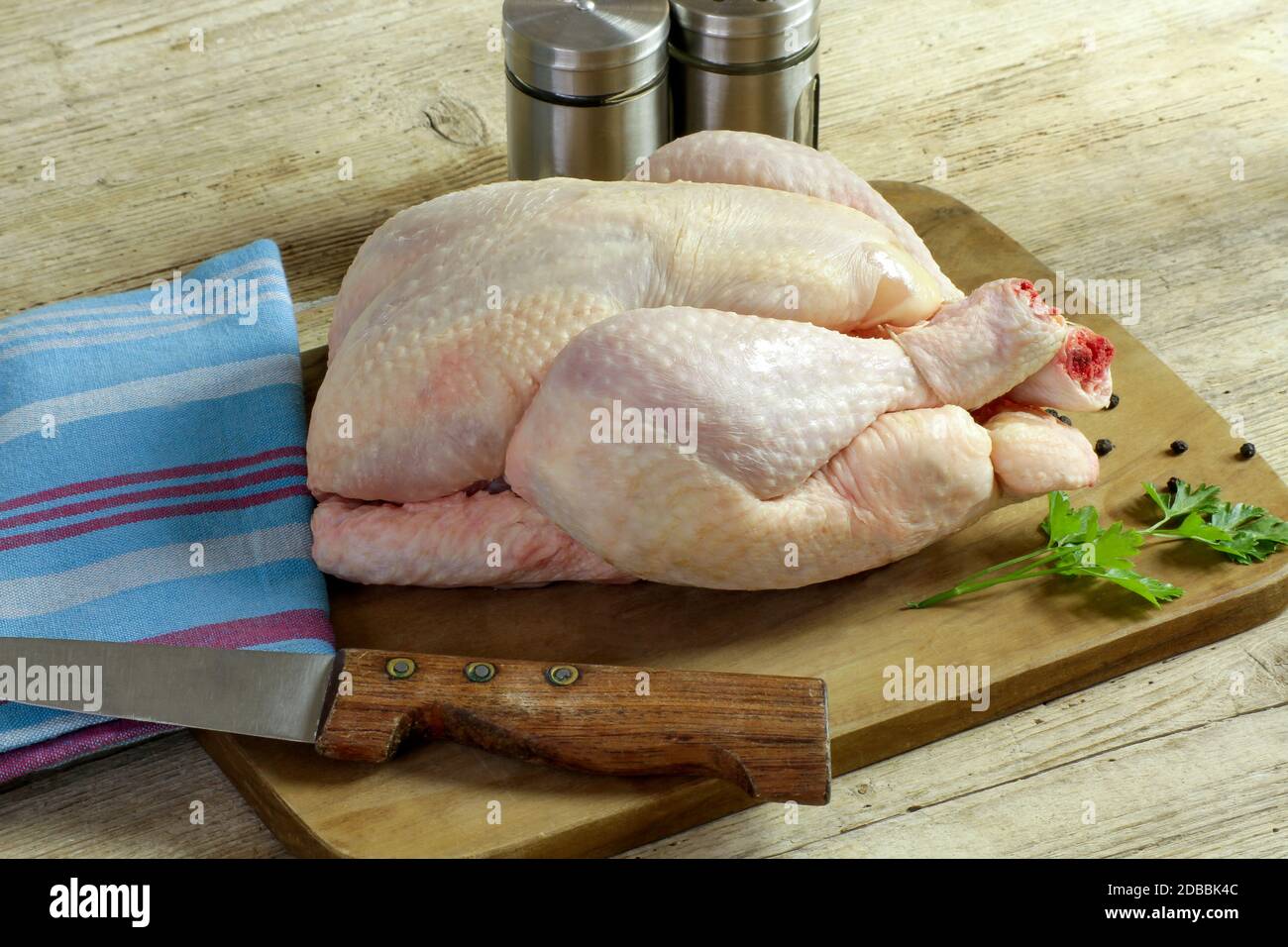 Raw chicken on plank hi-res stock photography and images - Alamy