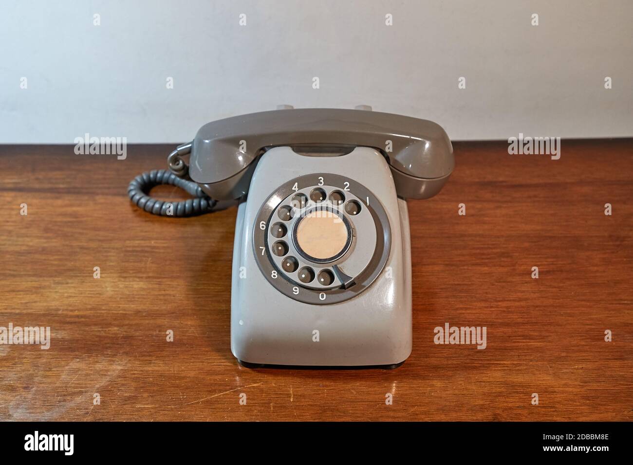 Vintage telephone on a table Stock Photo - Alamy