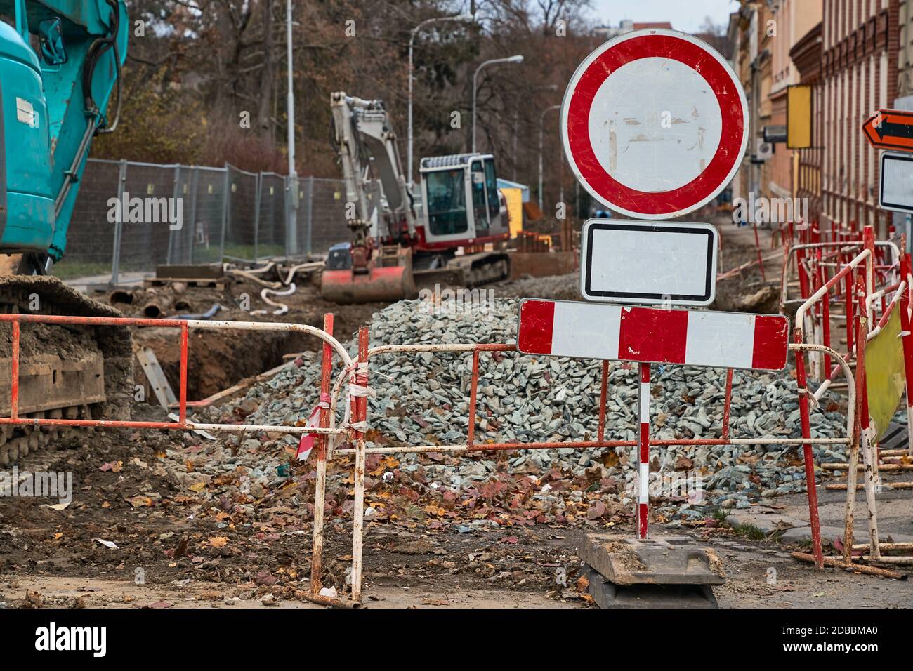 Road construction site closed steeet with excavators and other ...