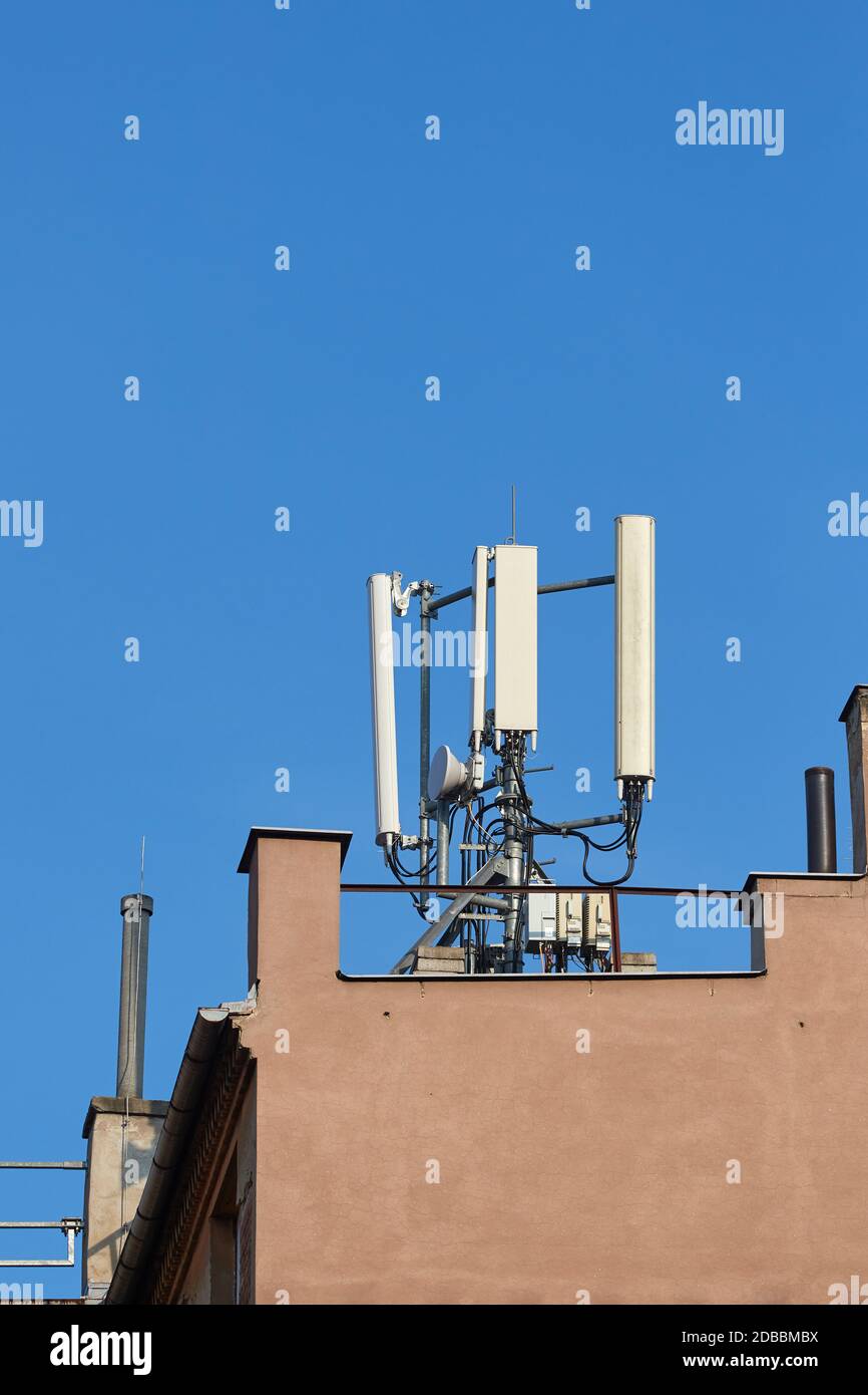 Signal transmitters for mobile network on a building roof Stock Photo ...