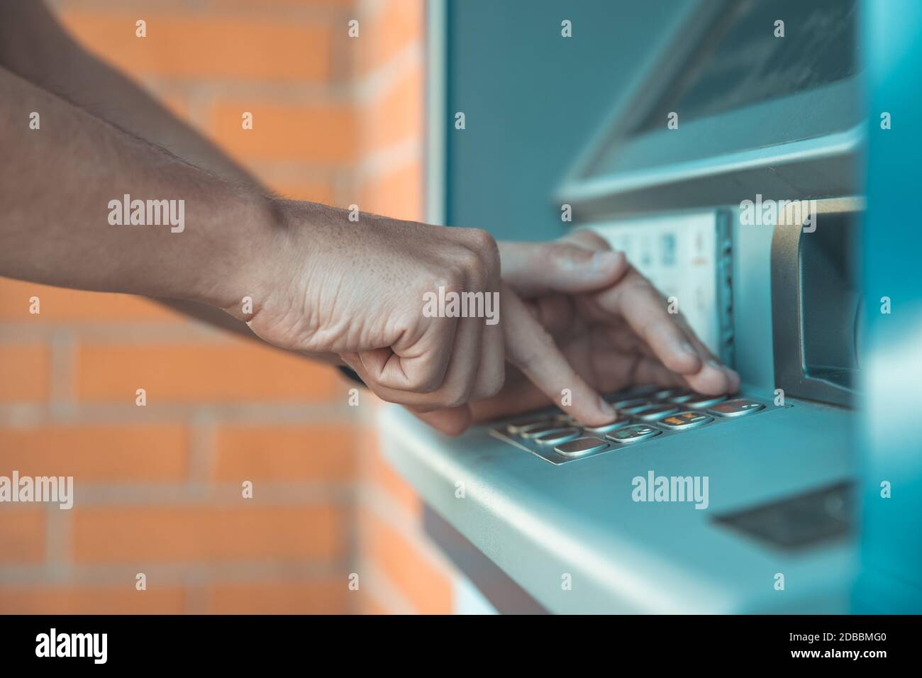 Entering a credit card code on the ATM keyboard Stock Photo - Alamy