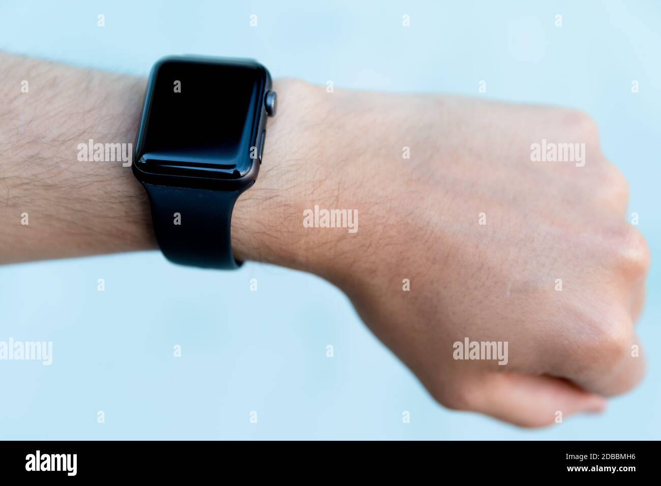smart watch on a wrist of a man's hand Stock Photo - Alamy