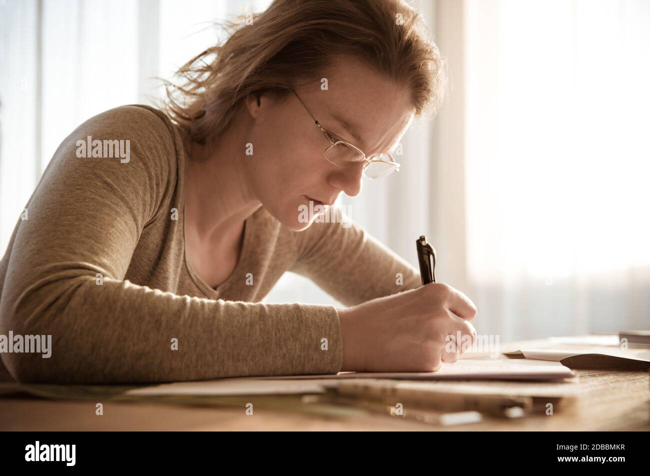 Focused on writing hi-res stock photography and images - Alamy