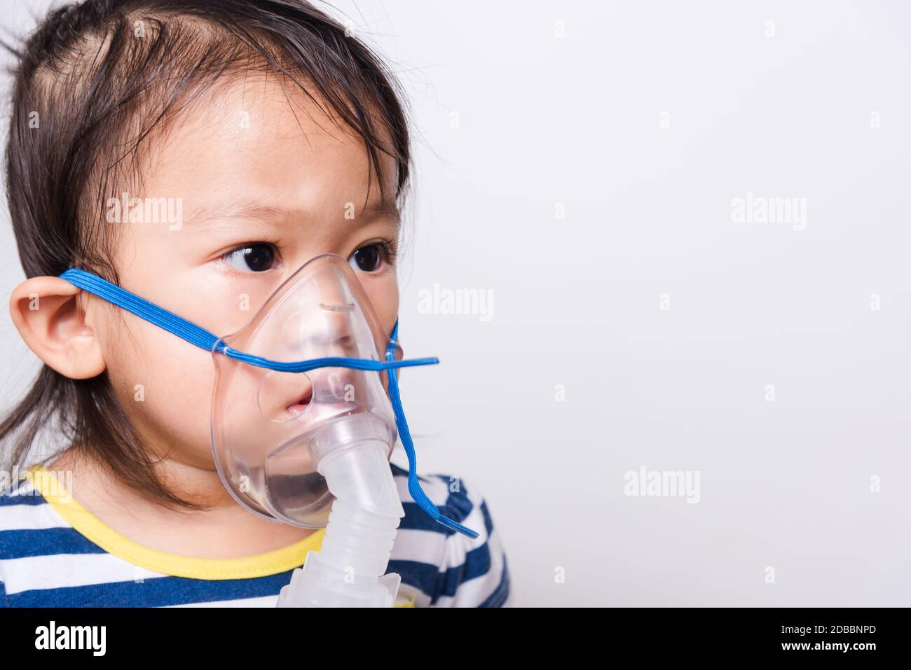 Closeup Asian face, Little baby girl sick her using steam inhaler ...