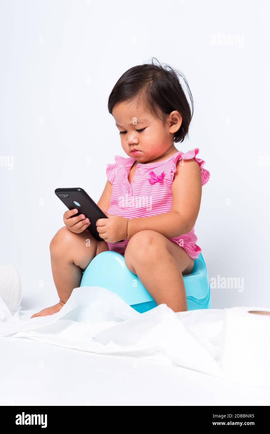 Asian little cute baby child girl education training to sitting on blue ...