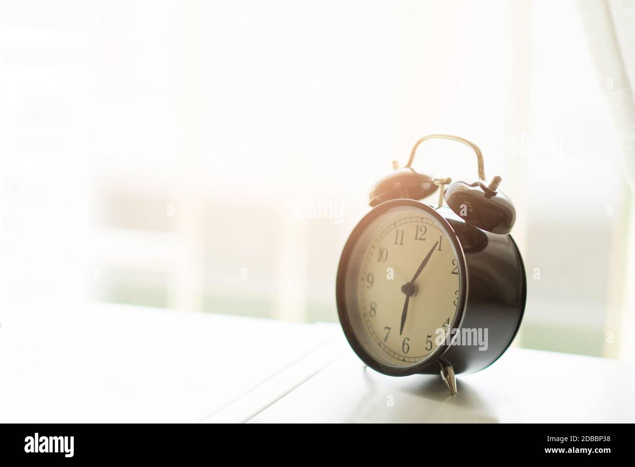 Alarm clock in the morning bedroom Stock Photo - Alamy